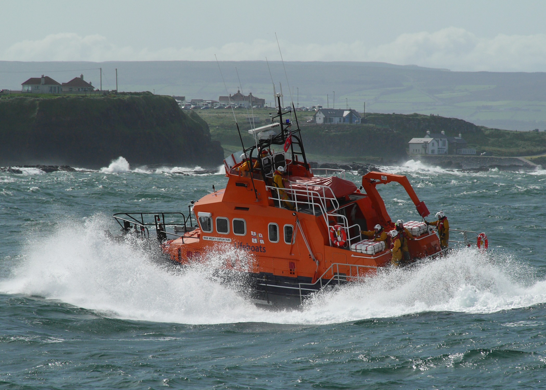 Portrush RNLI volunteers and lifeguard supervisor assist man in ...