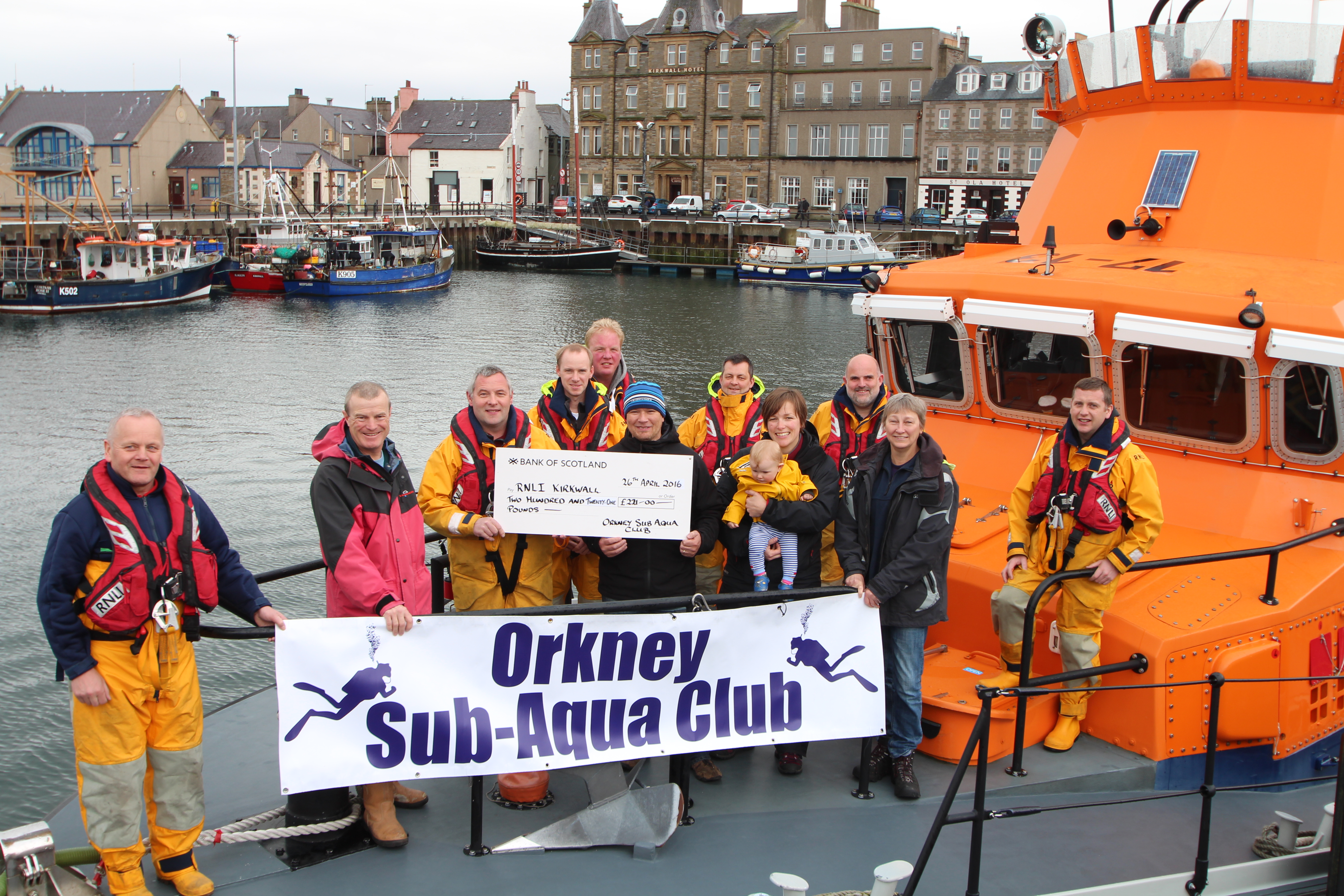 Baby "Bea" joins Orkney Sub-Aqua Club in presenting cheque to Kirkwall ...