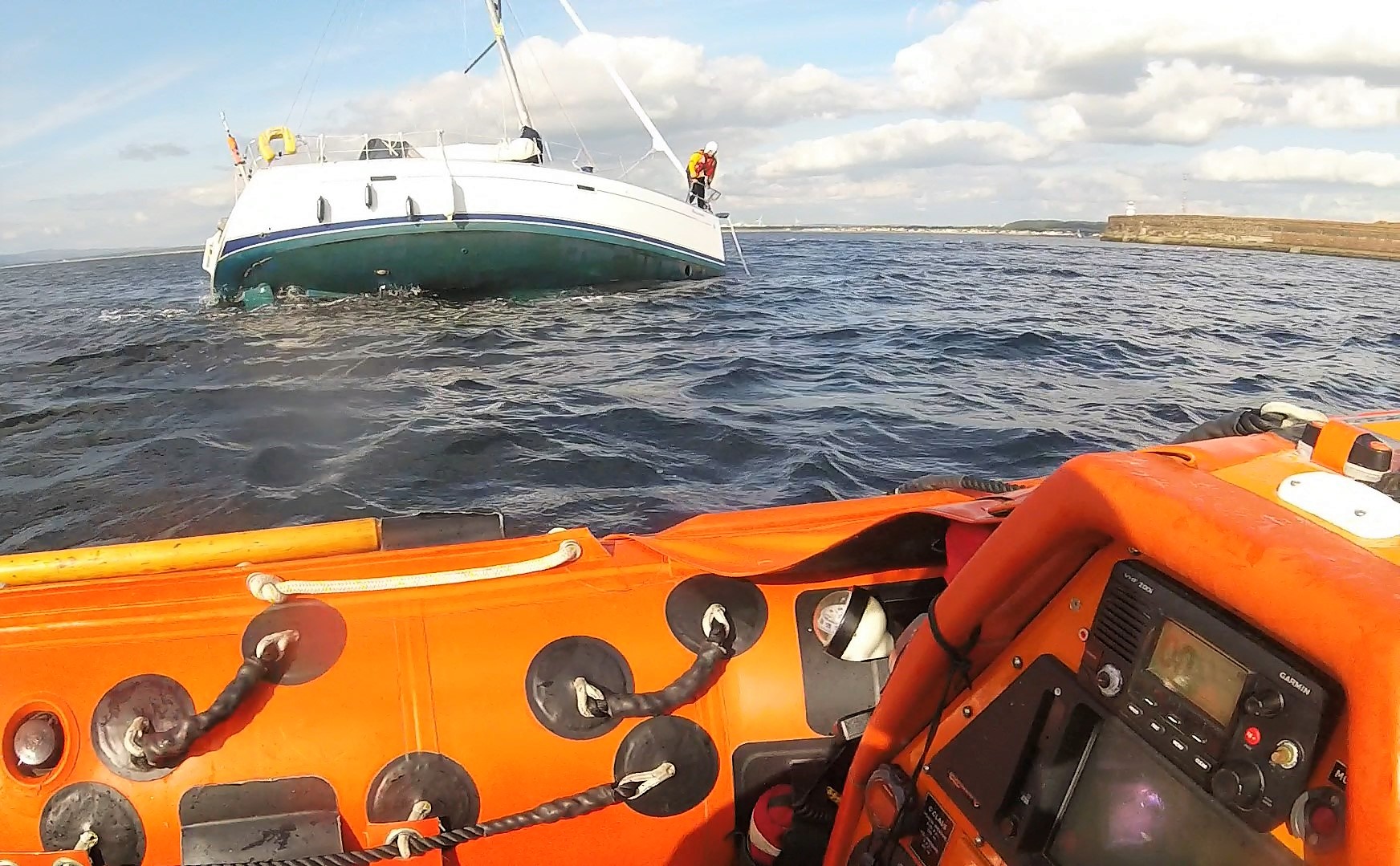 Troon lifeboats launch to yacht aground outside Troon harbour | RNLI