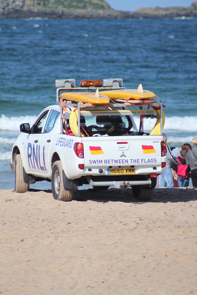 Portrush RNLI and beach lifeguards rescue swimmer who gets into ...