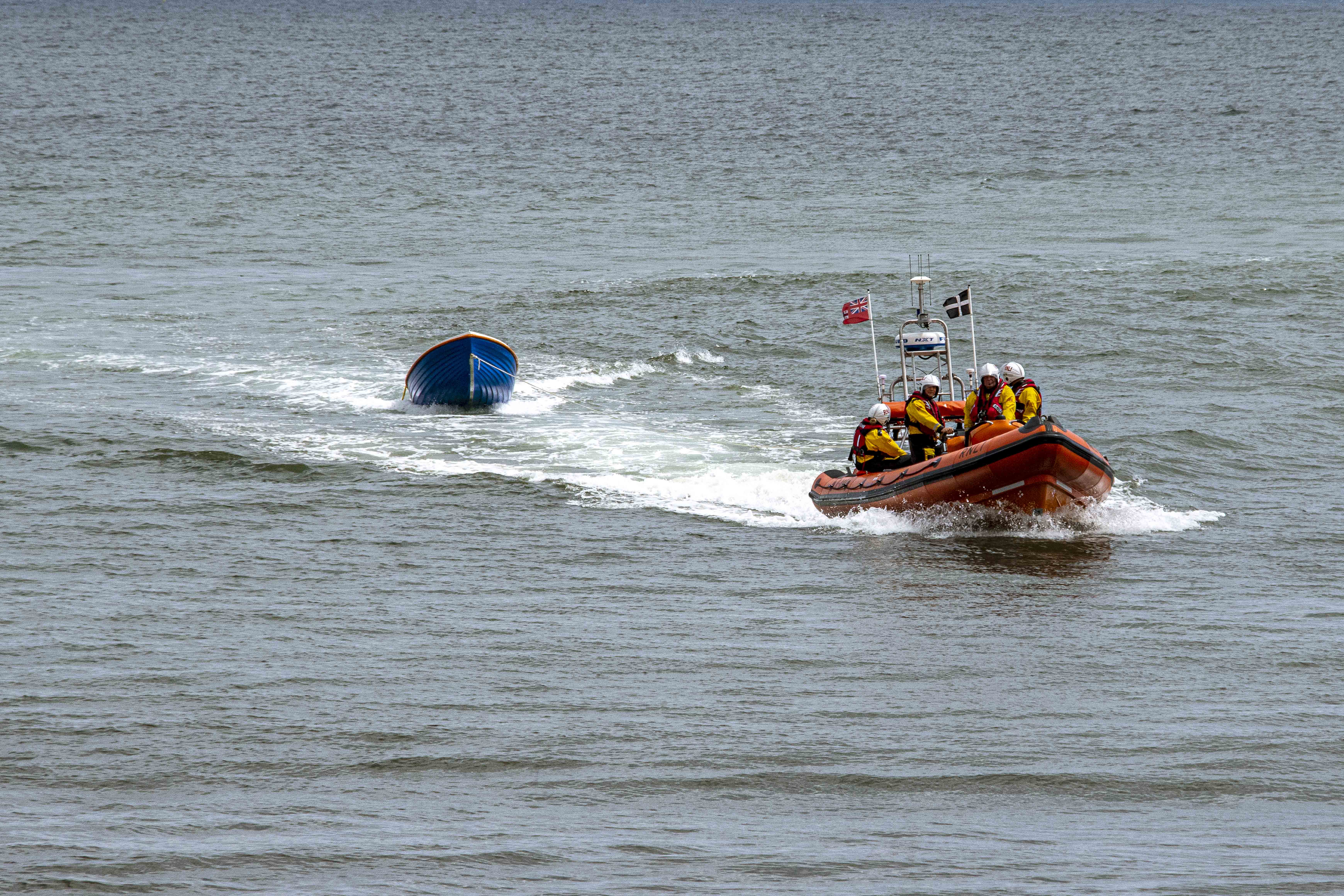 Looe RNLI volunteers investigate an empty blue tender drifting off ...