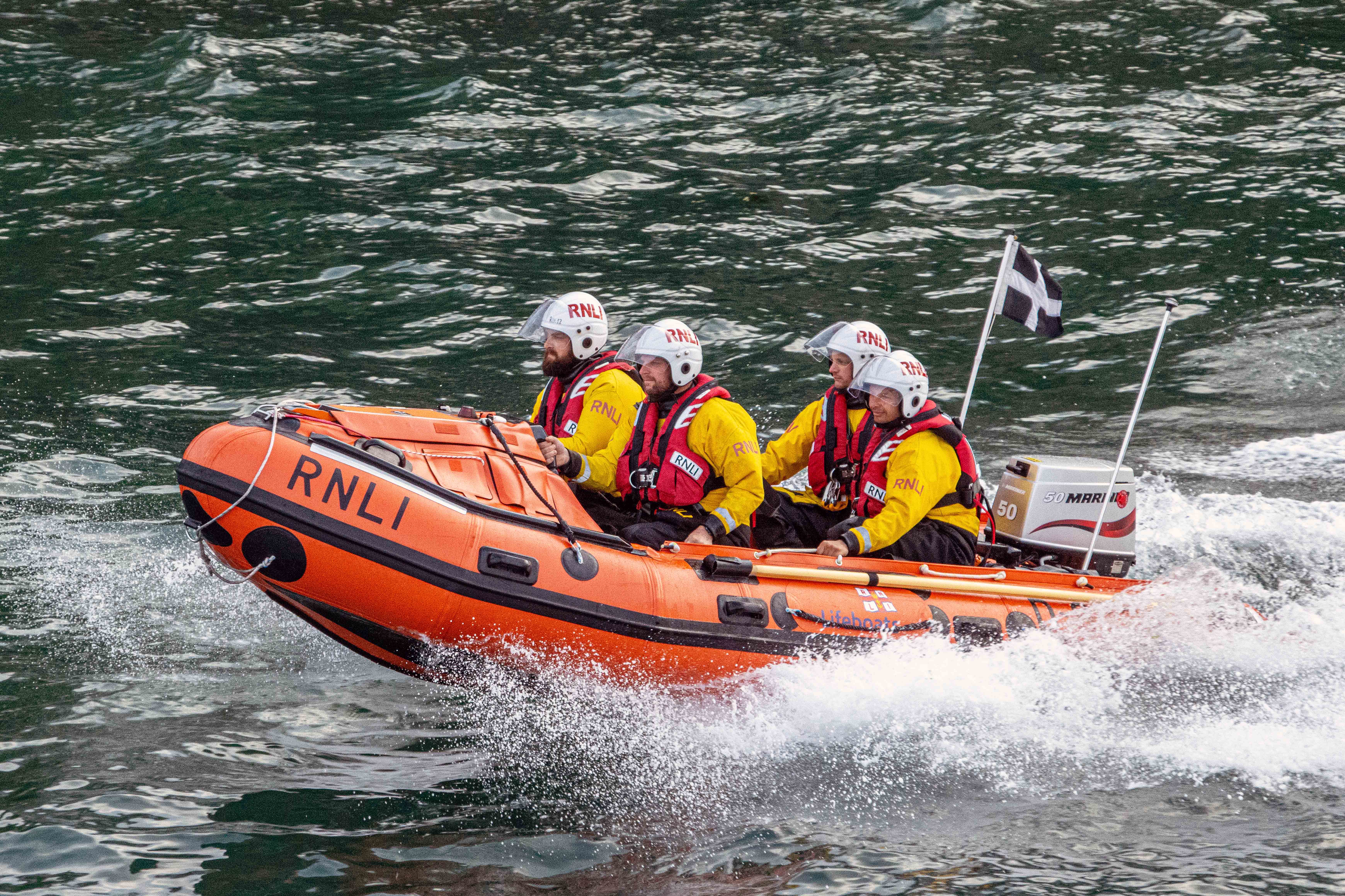 Looe RNLI volunteers rescue a swimmer in difficulties in Looe River | RNLI