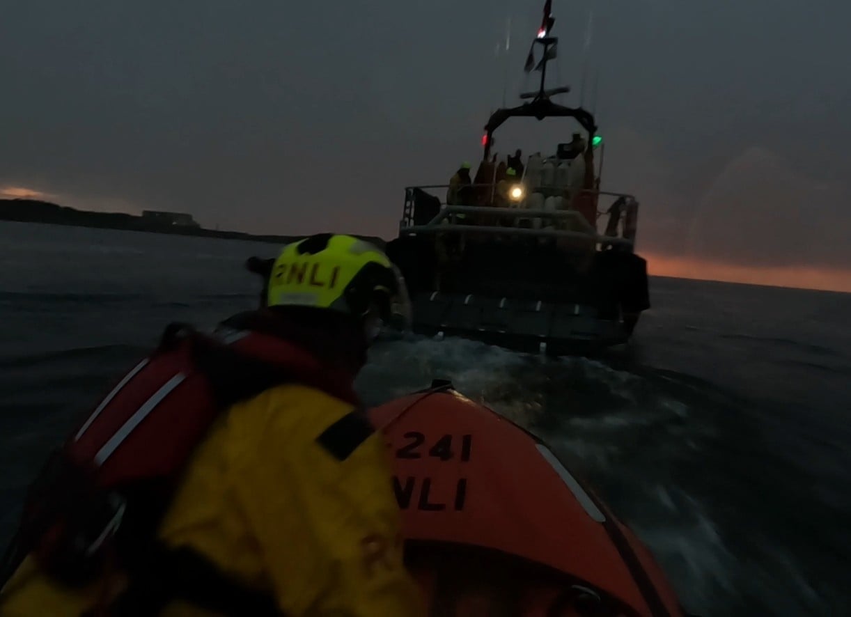 Watch Moelfre RNLI rescue paddleboarder and dog during thunder and ...